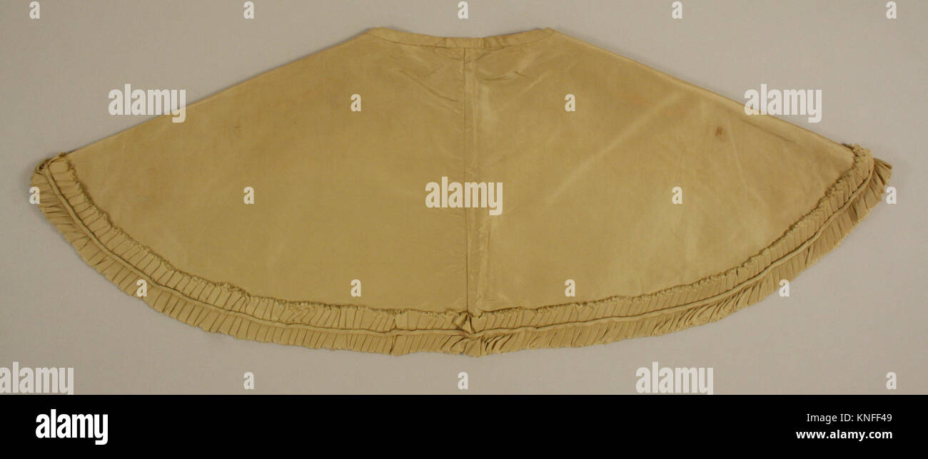 This ensemble, part of historical fashion, features multiple garments ...