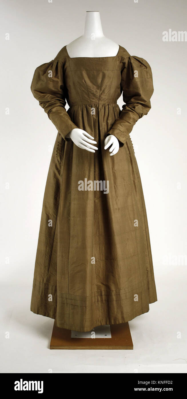 This dress showcases the fashion trends of its period, with an emphasis ...