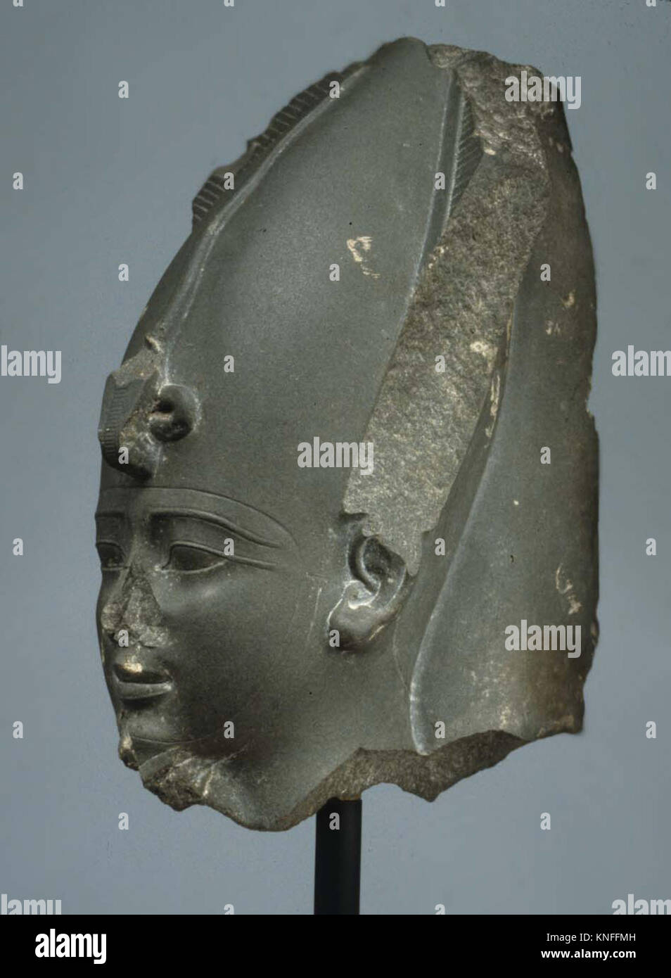 This ancient Egyptian sculpture features the head of Osiris, wearing ...