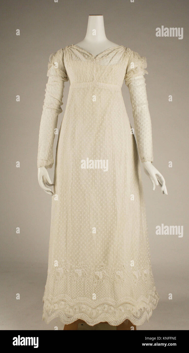 This dress exemplifies 19th-century fashion, showcasing intricate ...