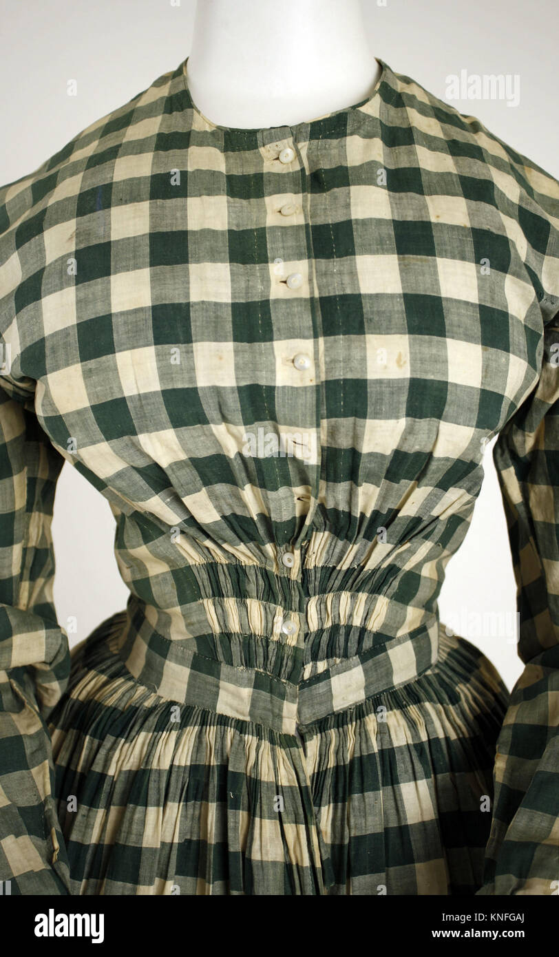 This dress is a fine example of historical textile design, reflecting ...