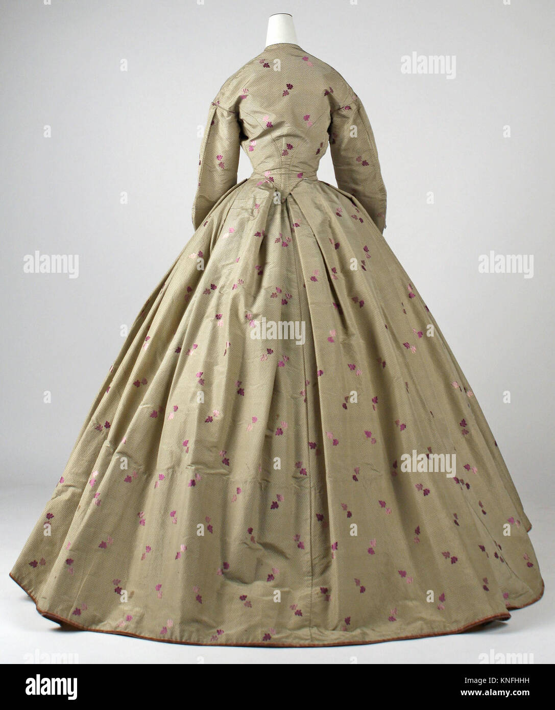 This dress is an example of period fashion, showcasing textile ...