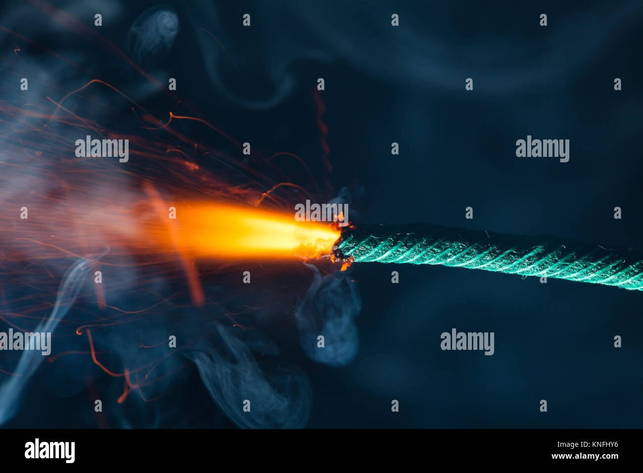 Burning fuse with sparks on black background Stock Photo - Alamy