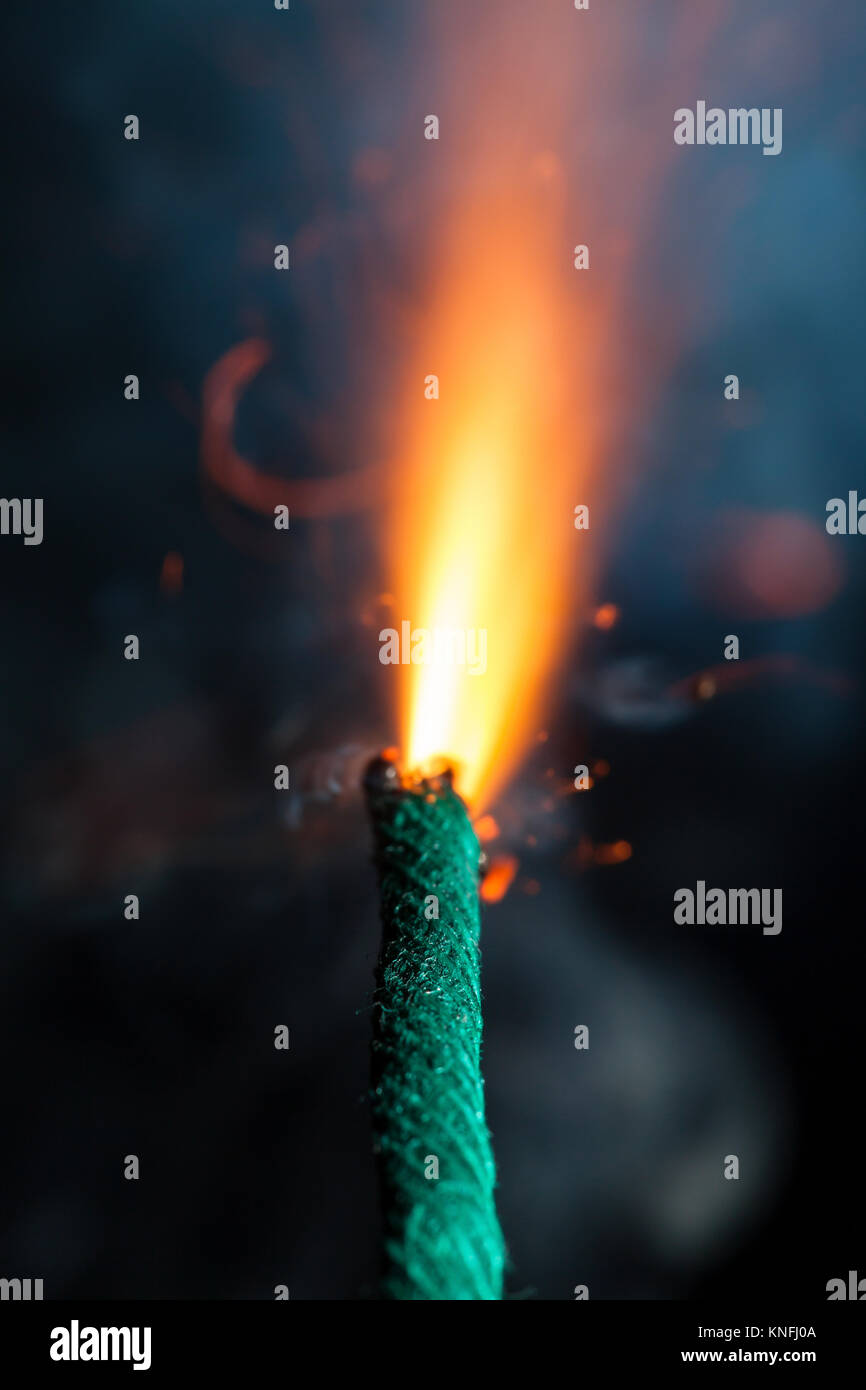 Burning fuse with sparks on black background Stock Photo - Alamy