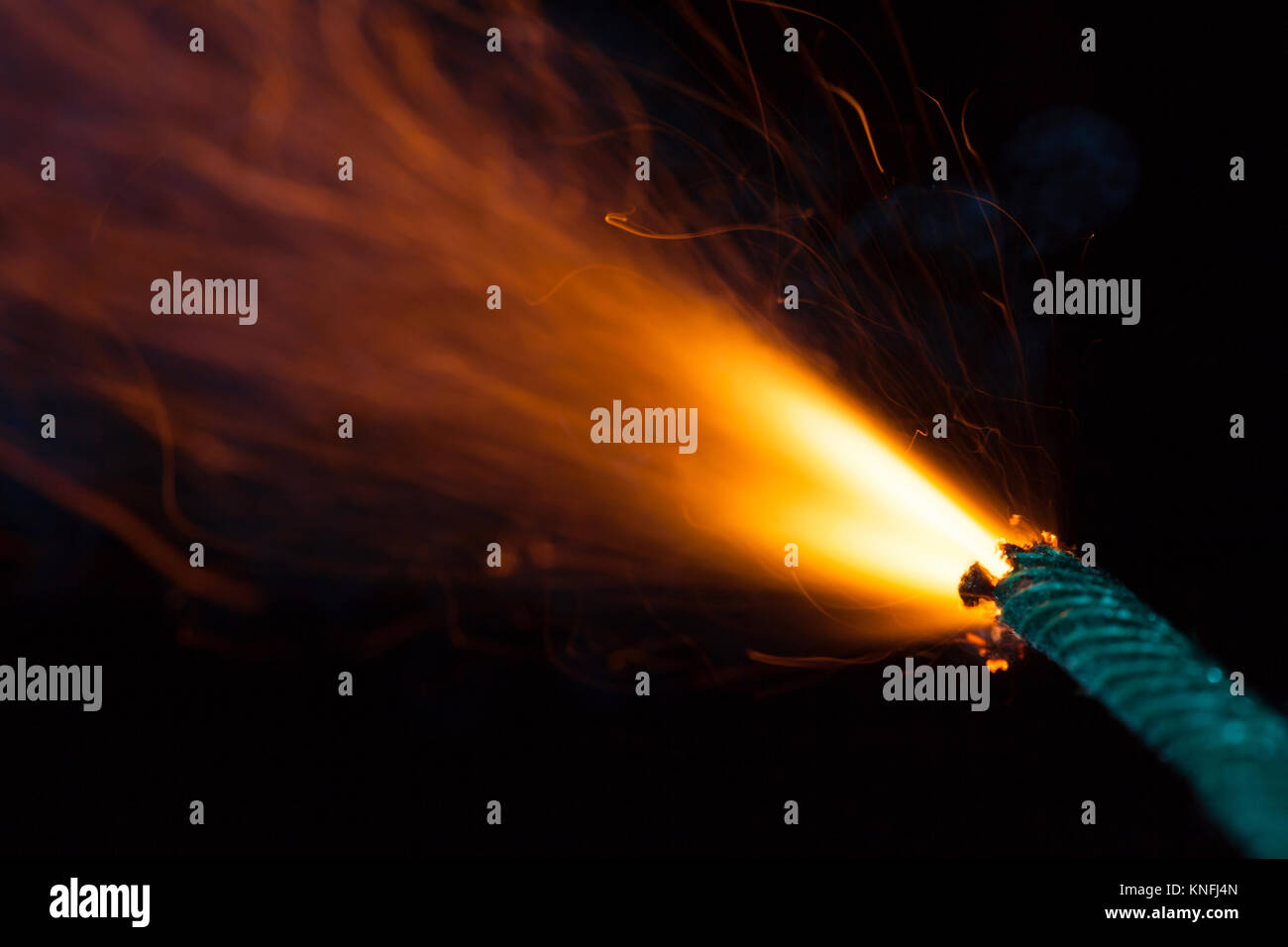 Burning fuse with sparks on black background Stock Photo - Alamy