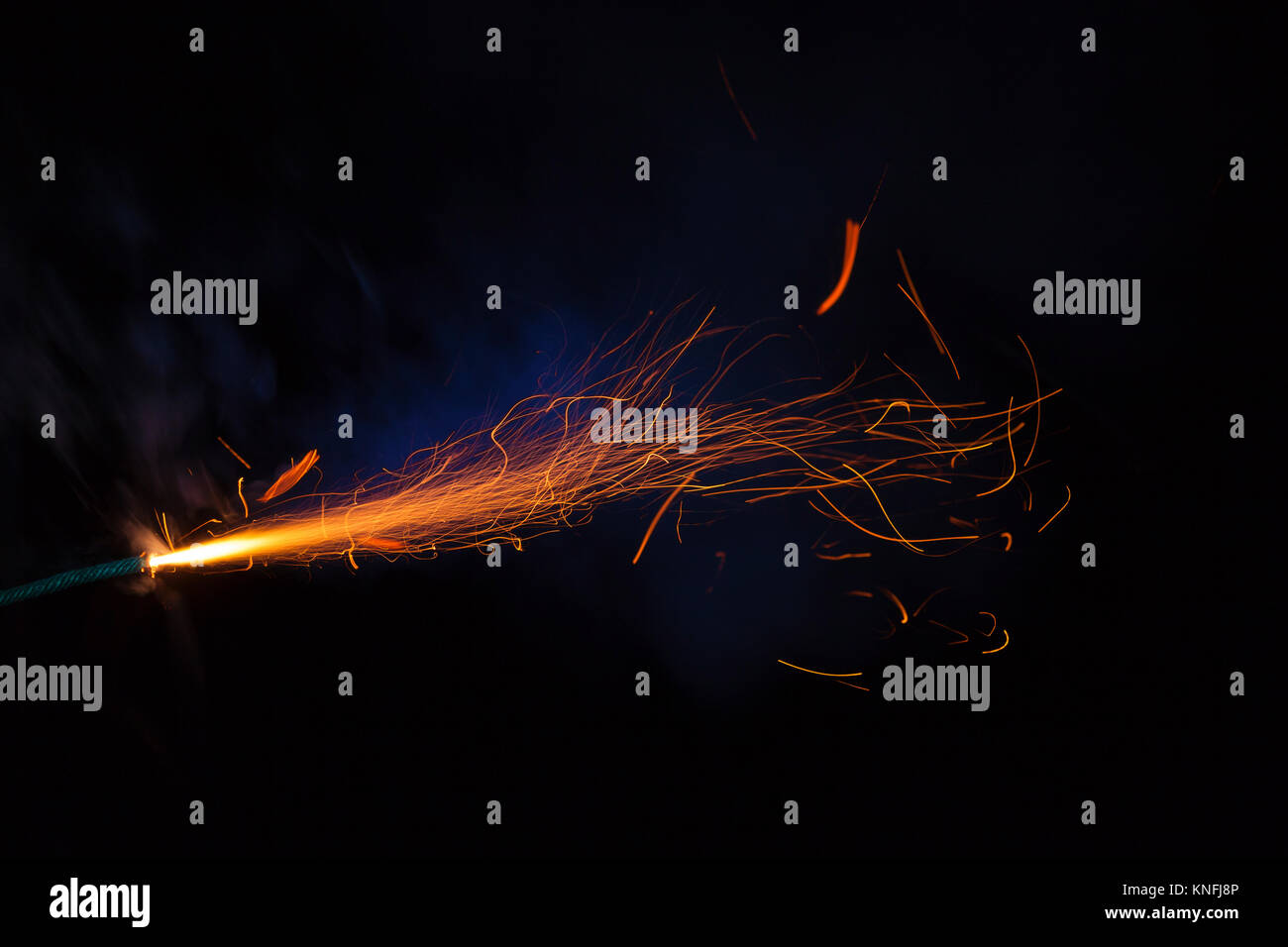 Burning fuse with sparks and blue smoke on black background Stock Photo ...