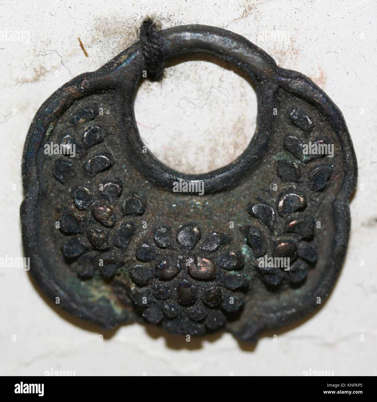 This button, crafted with intricate detailing, is an example of 19th ...