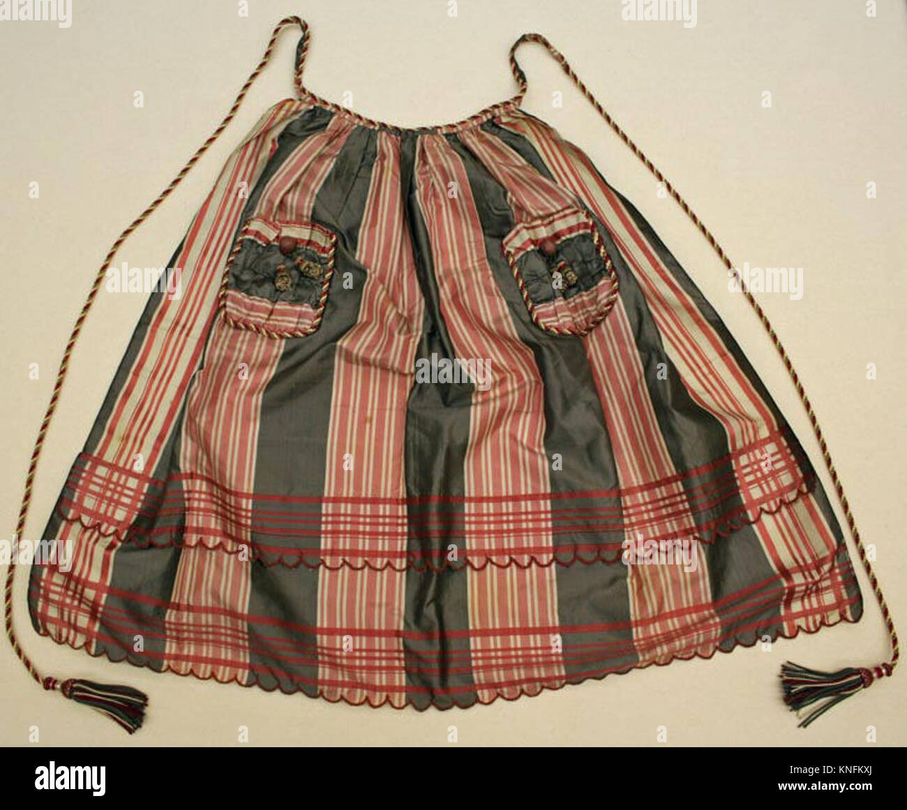 This apron, part of historical attire, showcases textile craftsmanship ...