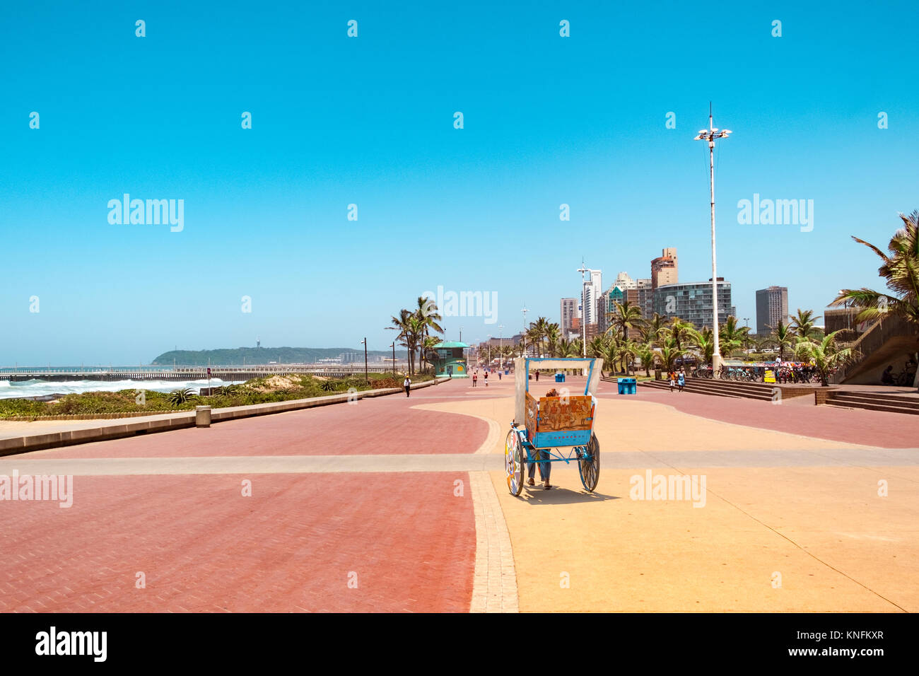 Promenade of Durban with traditional rickshaw driving on it Stock Photo ...