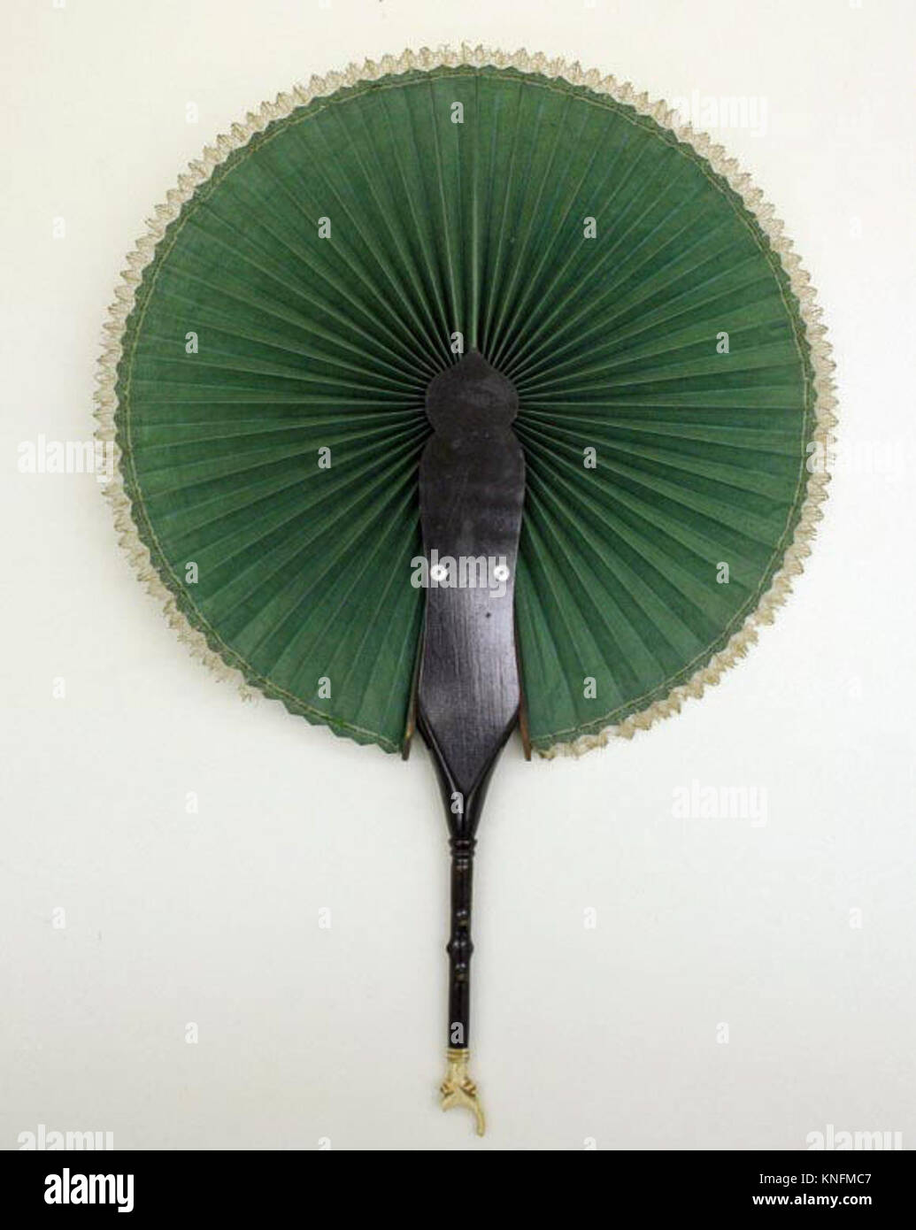 This fan is a decorative handheld object, often used for cooling, but ...