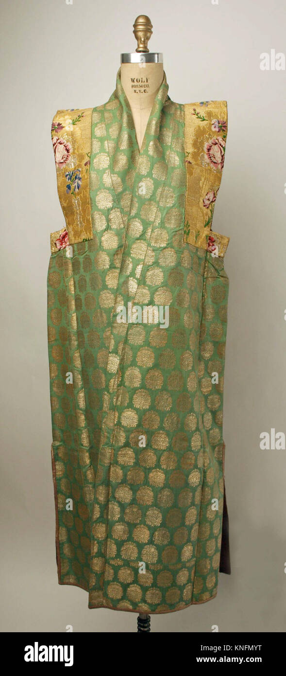 This dress represents the fashion of a particular period, showcasing ...