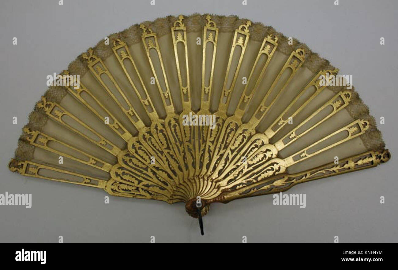 This fan, crafted with intricate design, was used both for practical ...