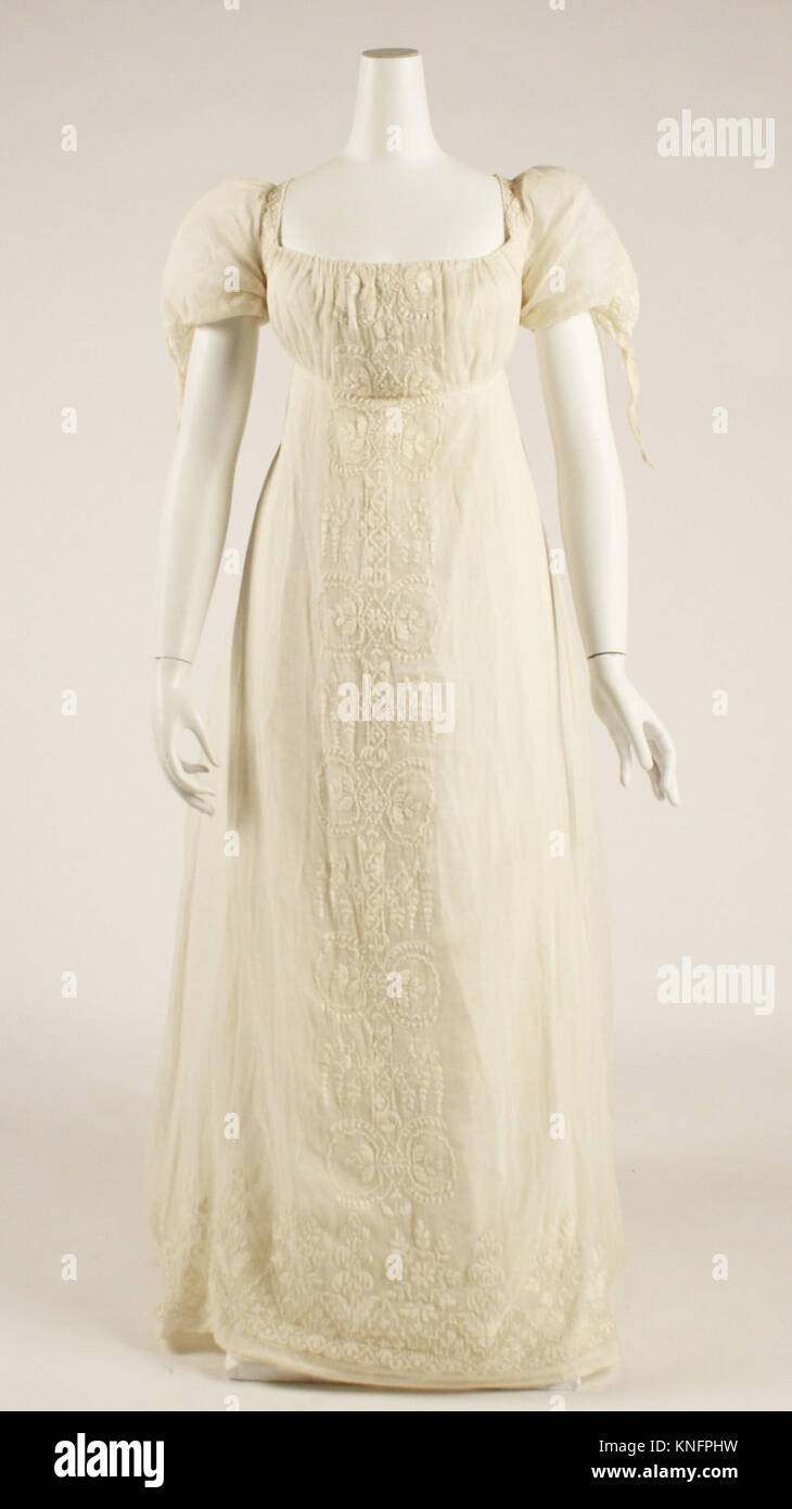 This evening dress features intricate design elements, showcasing the ...