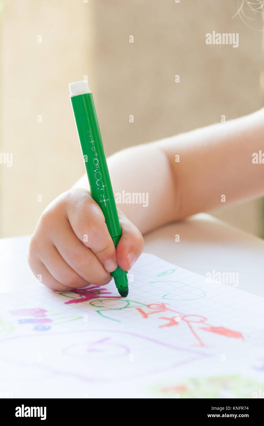 Hand of child drawing with pencil Stock Photo - Alamy
