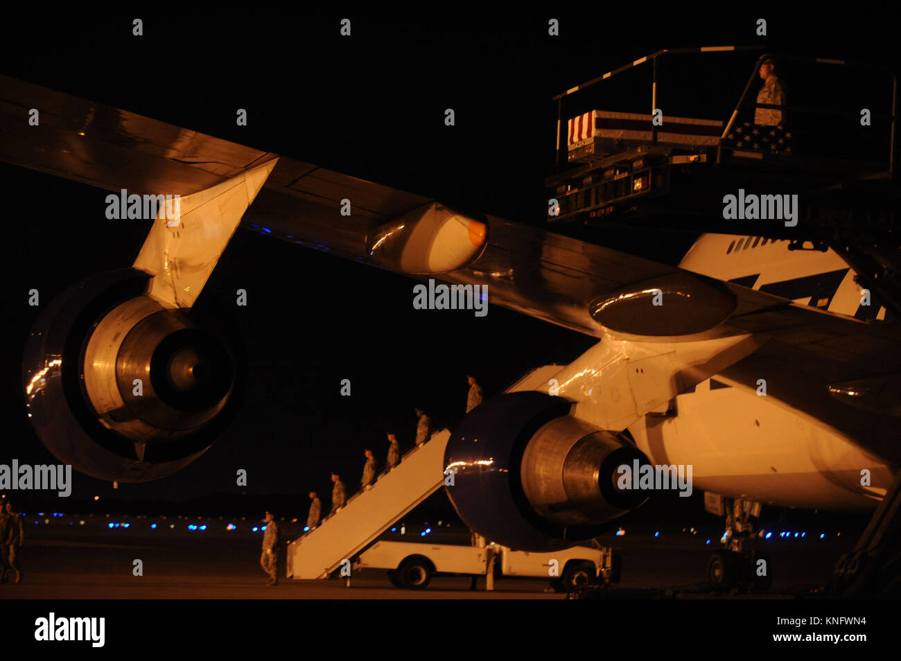 Air Force carry team carries a transfer case containing the remains of ...