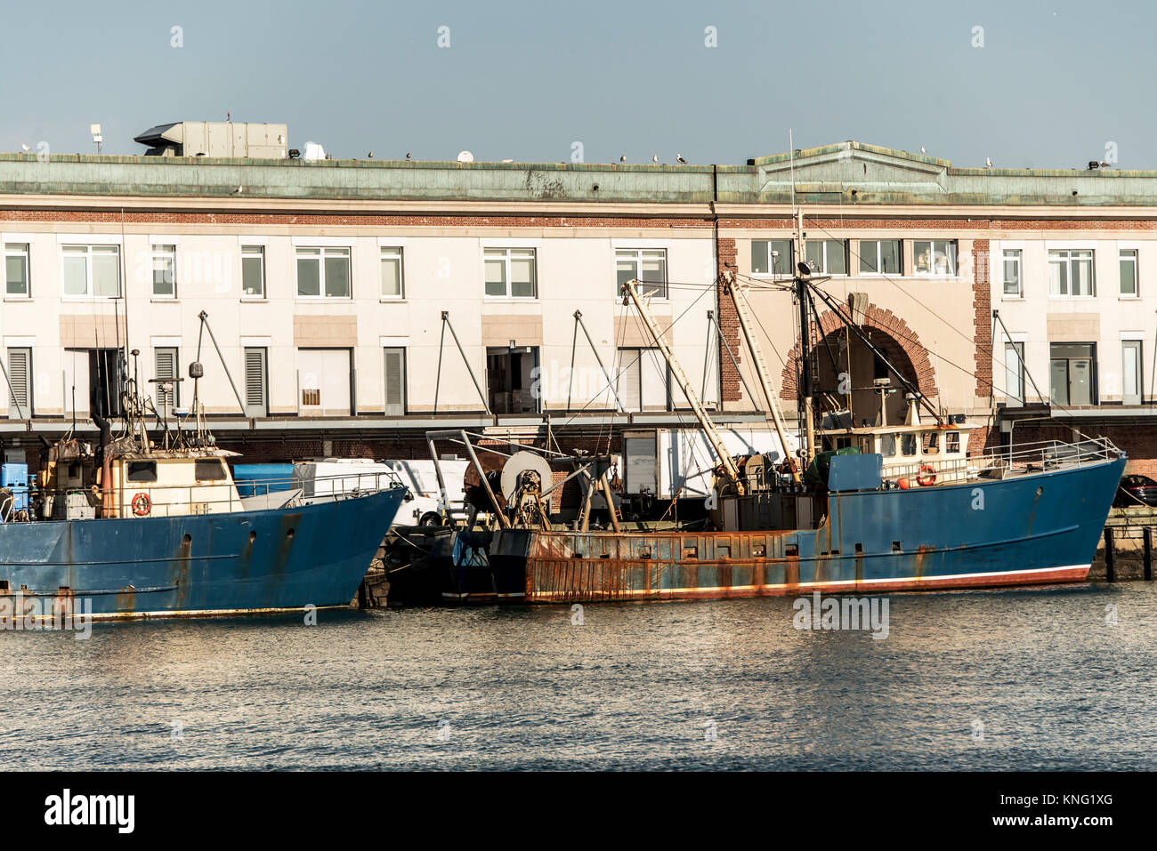 View of harbor from the Boston Waterfront with fishing boat trucks and ...