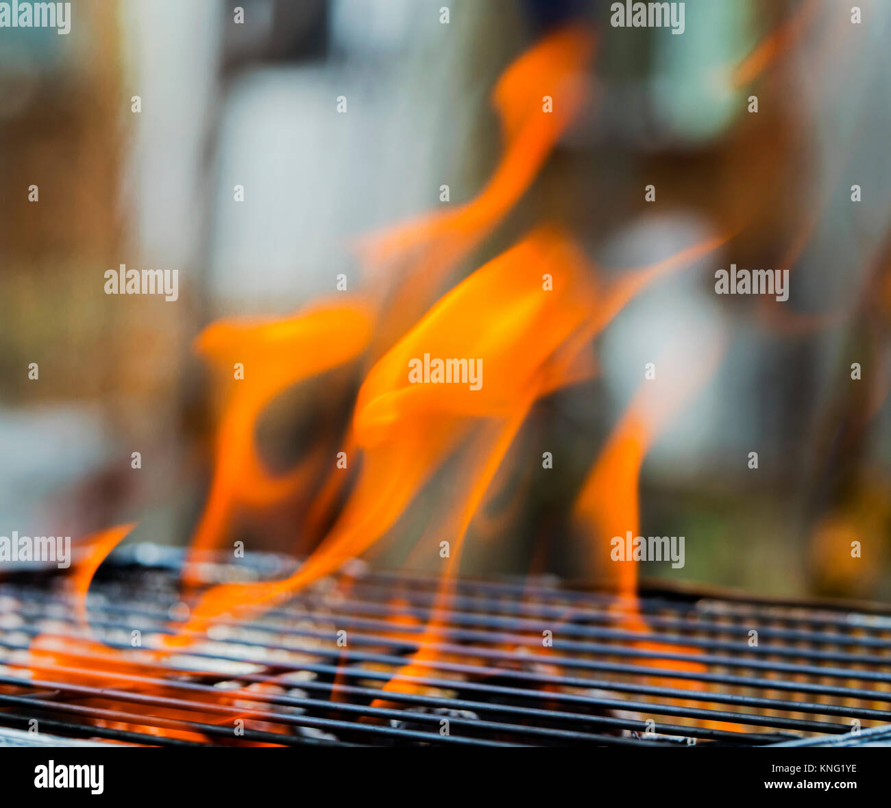 Burning flames and barbecue closeup Stock Photo - Alamy