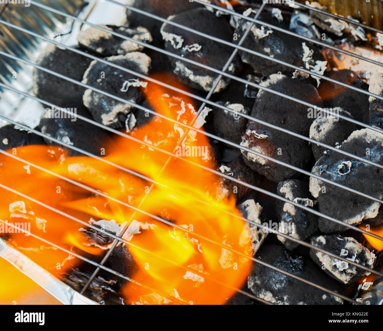 Burning flames and barbecue closeup Stock Photo - Alamy