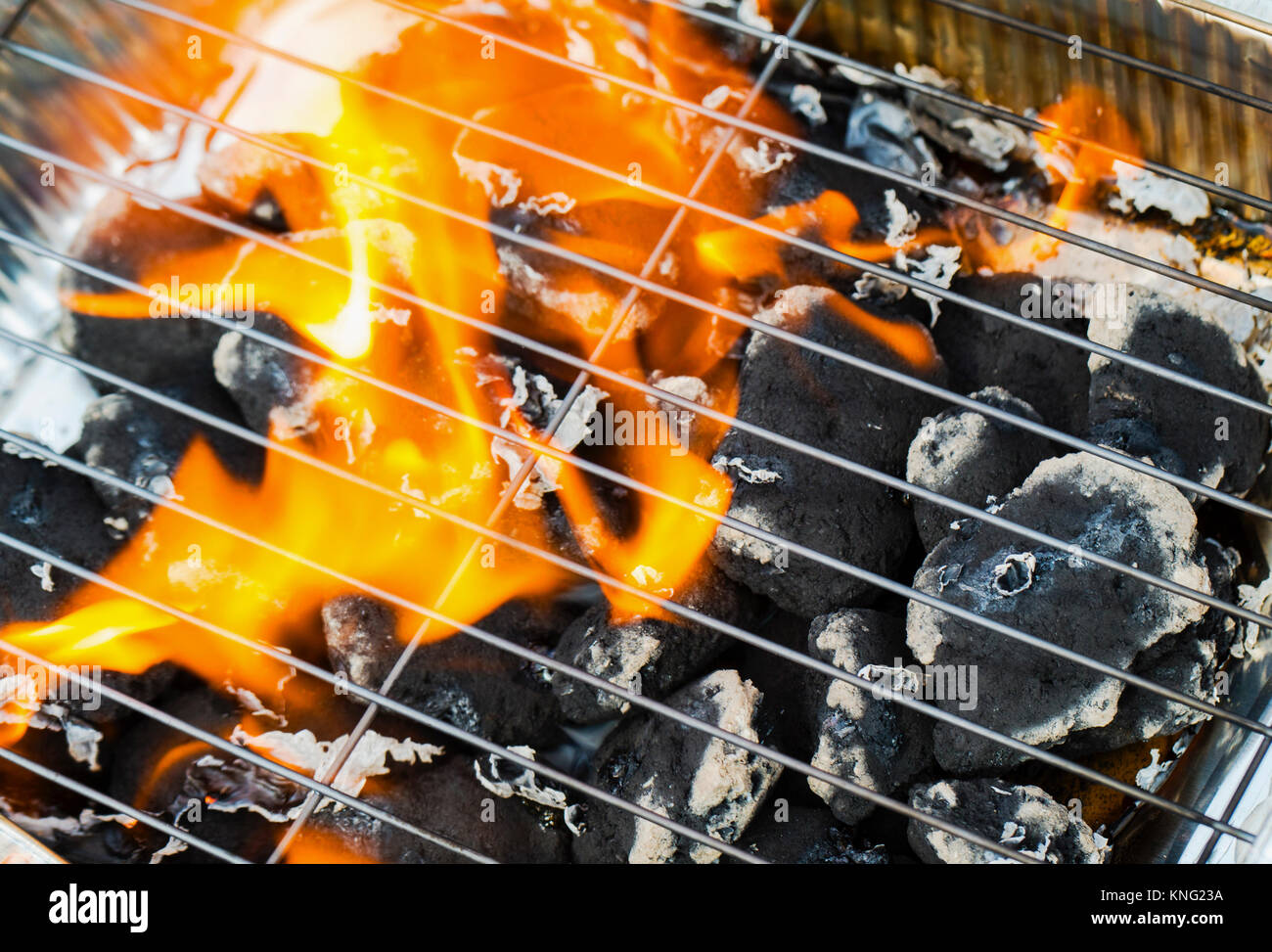 Burning flames and barbecue closeup Stock Photo - Alamy