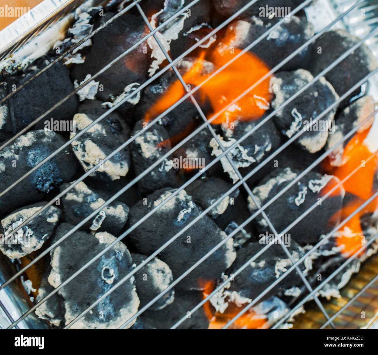 Burning flames and barbecue closeup Stock Photo - Alamy
