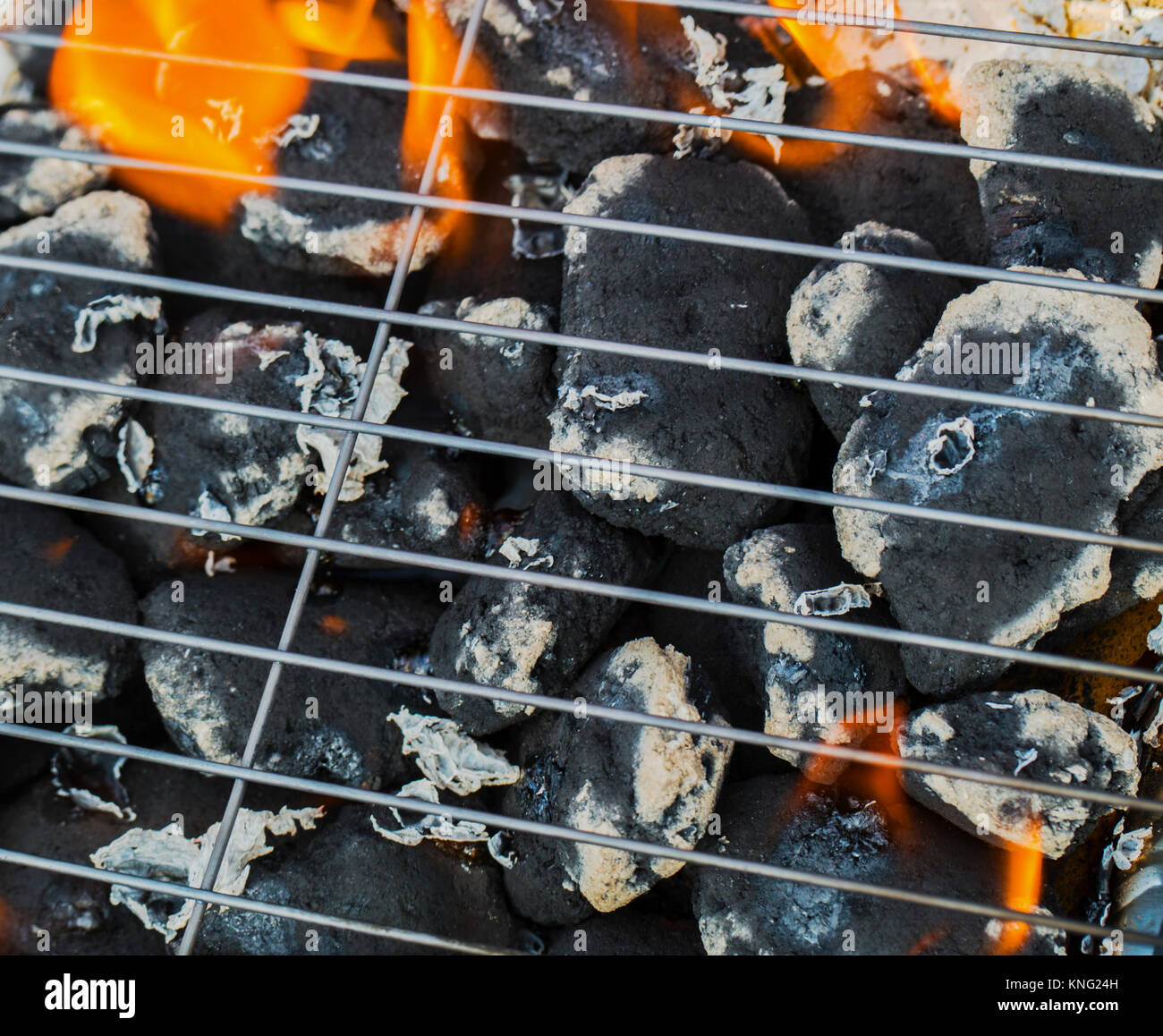 Burning flames and barbecue closeup Stock Photo - Alamy