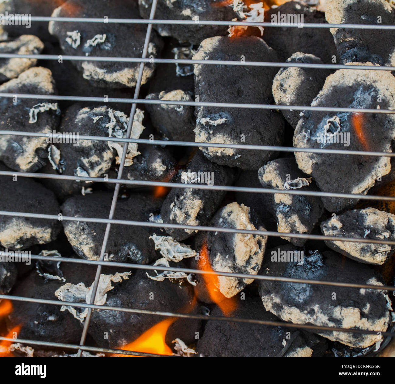 Burning flames and barbecue closeup Stock Photo - Alamy