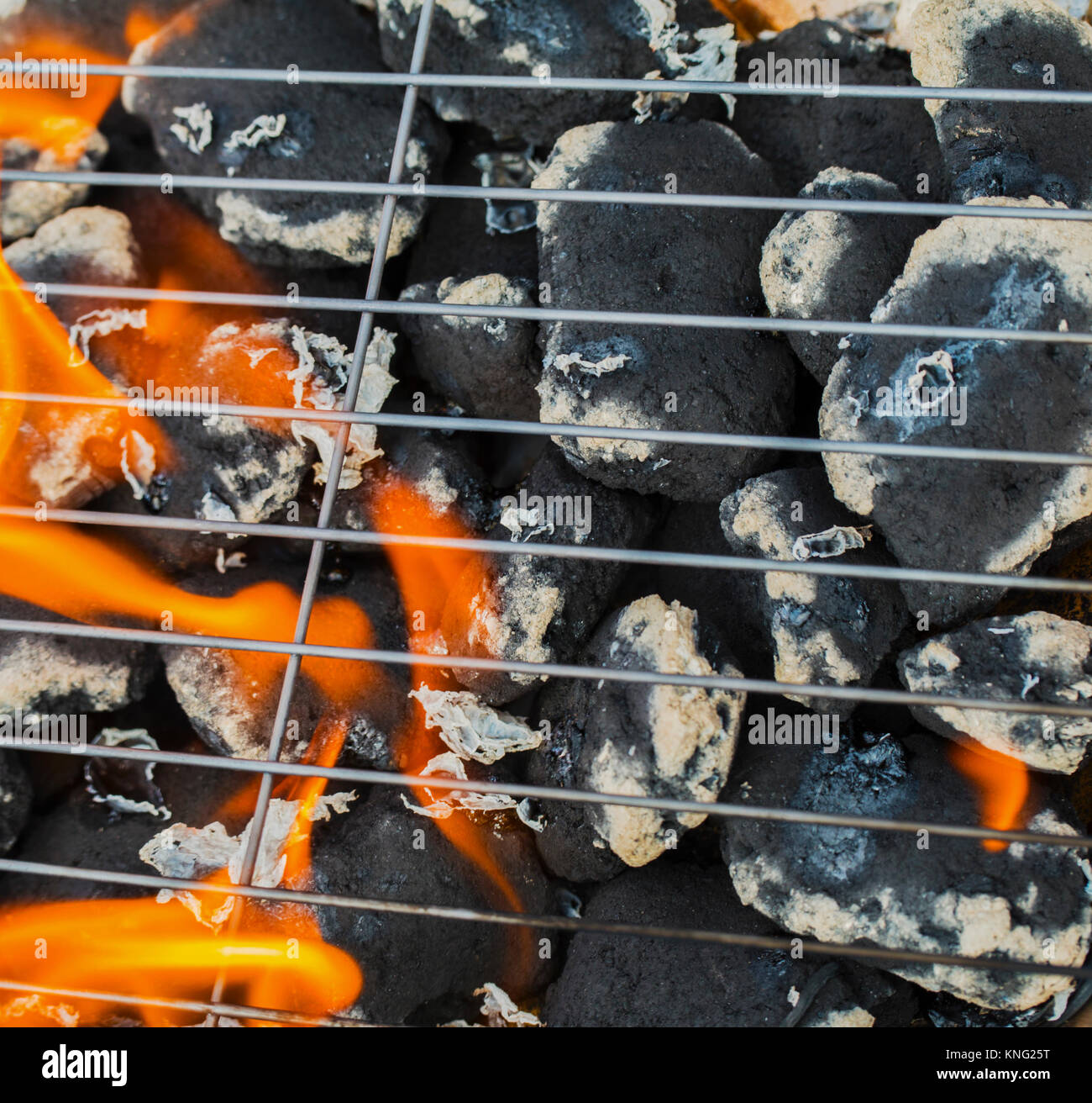 Burning flames and barbecue closeup Stock Photo - Alamy