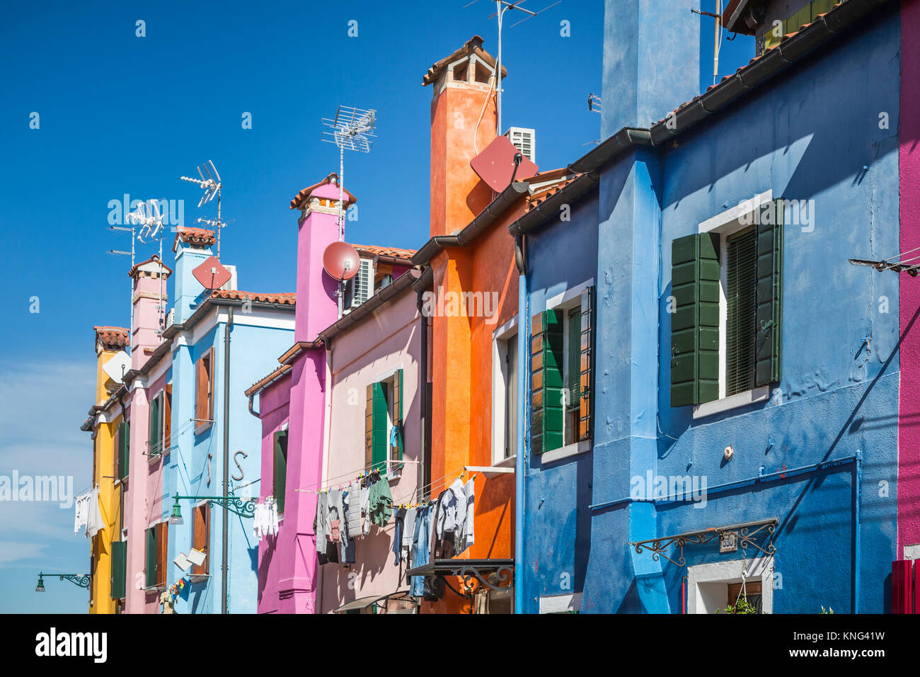 The colorful buildings, canals and boats in the Venetian village of ...