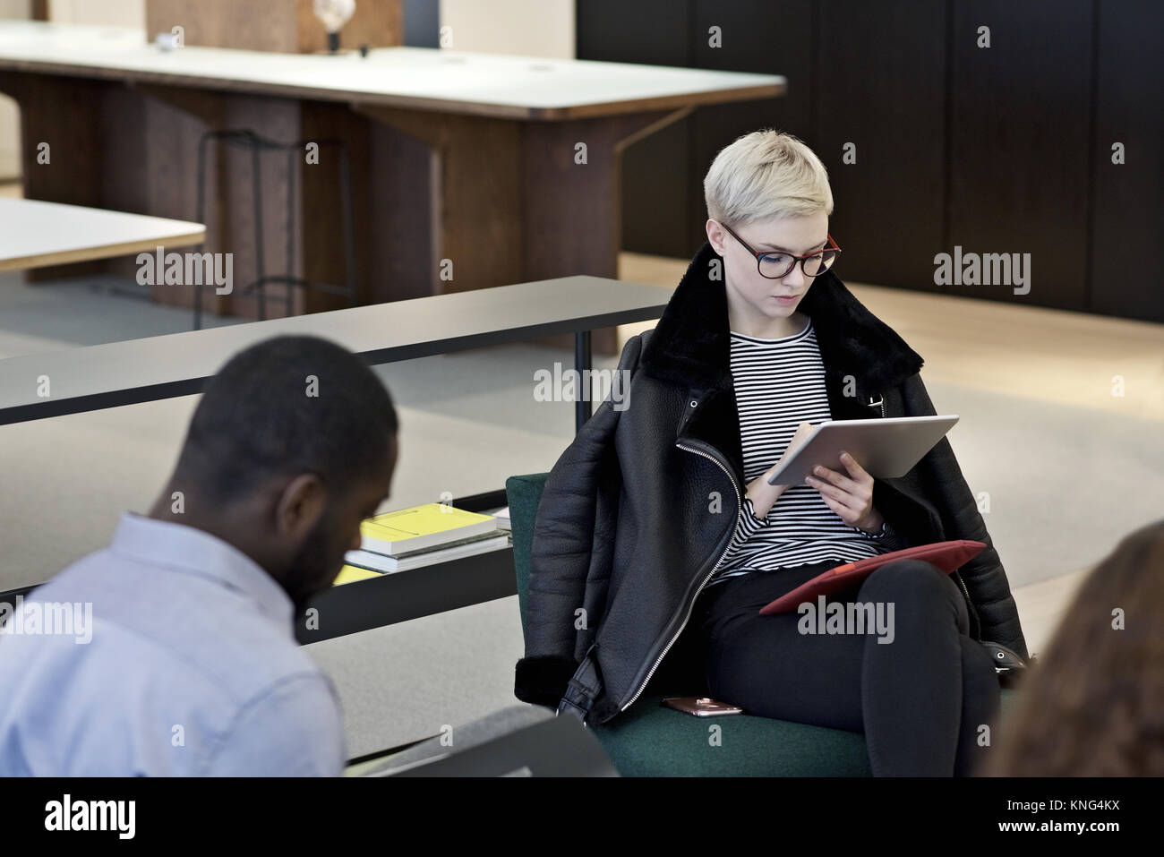 Woman tapping device swiping tablet hi-res stock photography and images ...