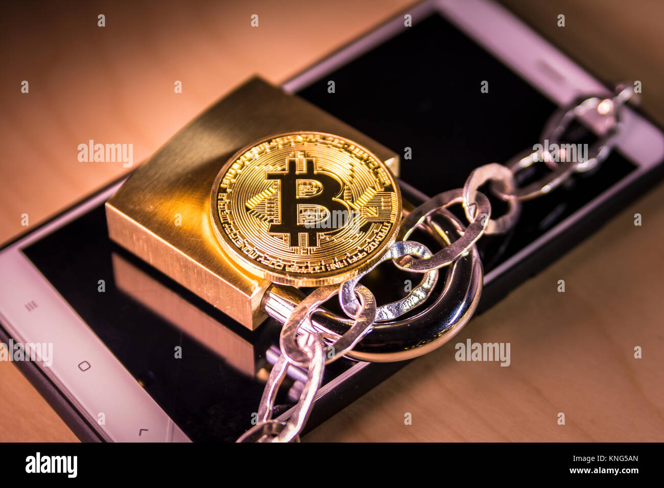 Bitcoin, padlock and chain over a screen Stock Photo - Alamy