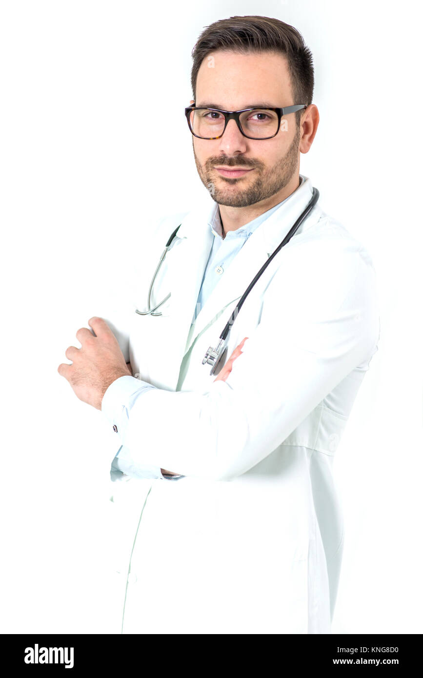 Portrait of handsome young doctor in white medical uniform looking at ...