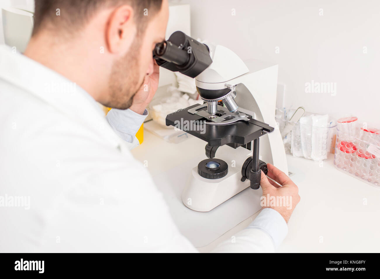 Doctor looks microscope hi-res stock photography and images - Alamy