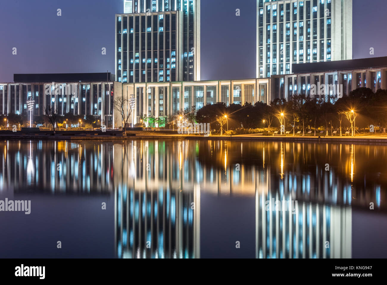 buildings standing by riverside under dramatic sky,wuxi city,jiangsu ...