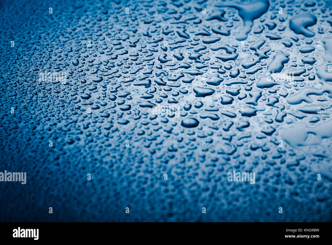 Wet metal background,in blue tone Stock Photo - Alamy