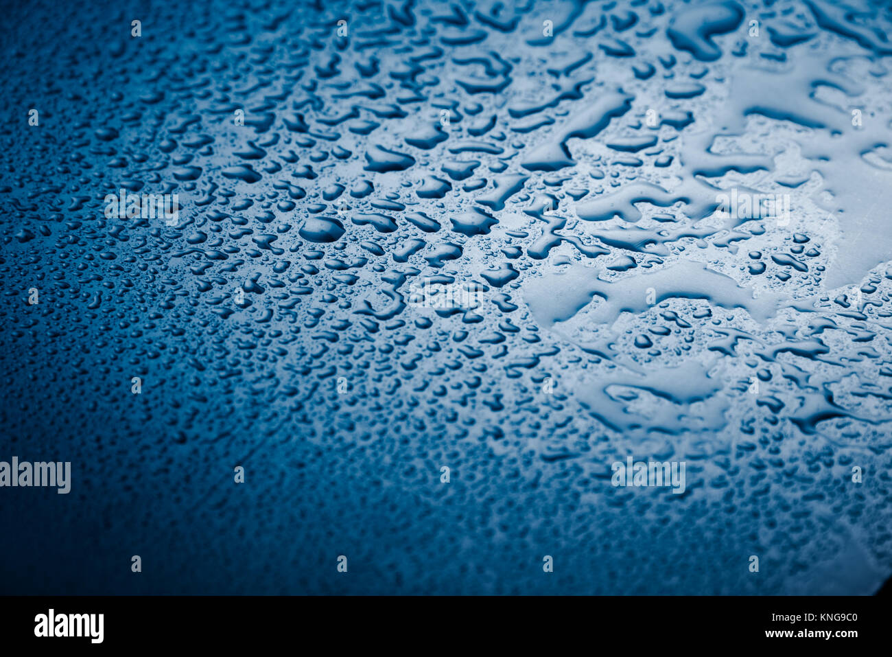 Wet metal background,in blue tone Stock Photo - Alamy