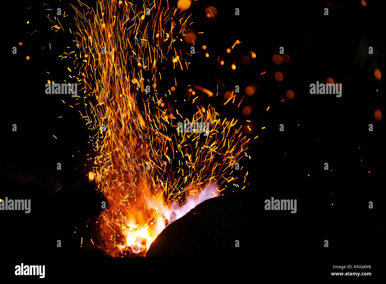 Smithy fire flame tips with sparks closeup on dark background Stock ...