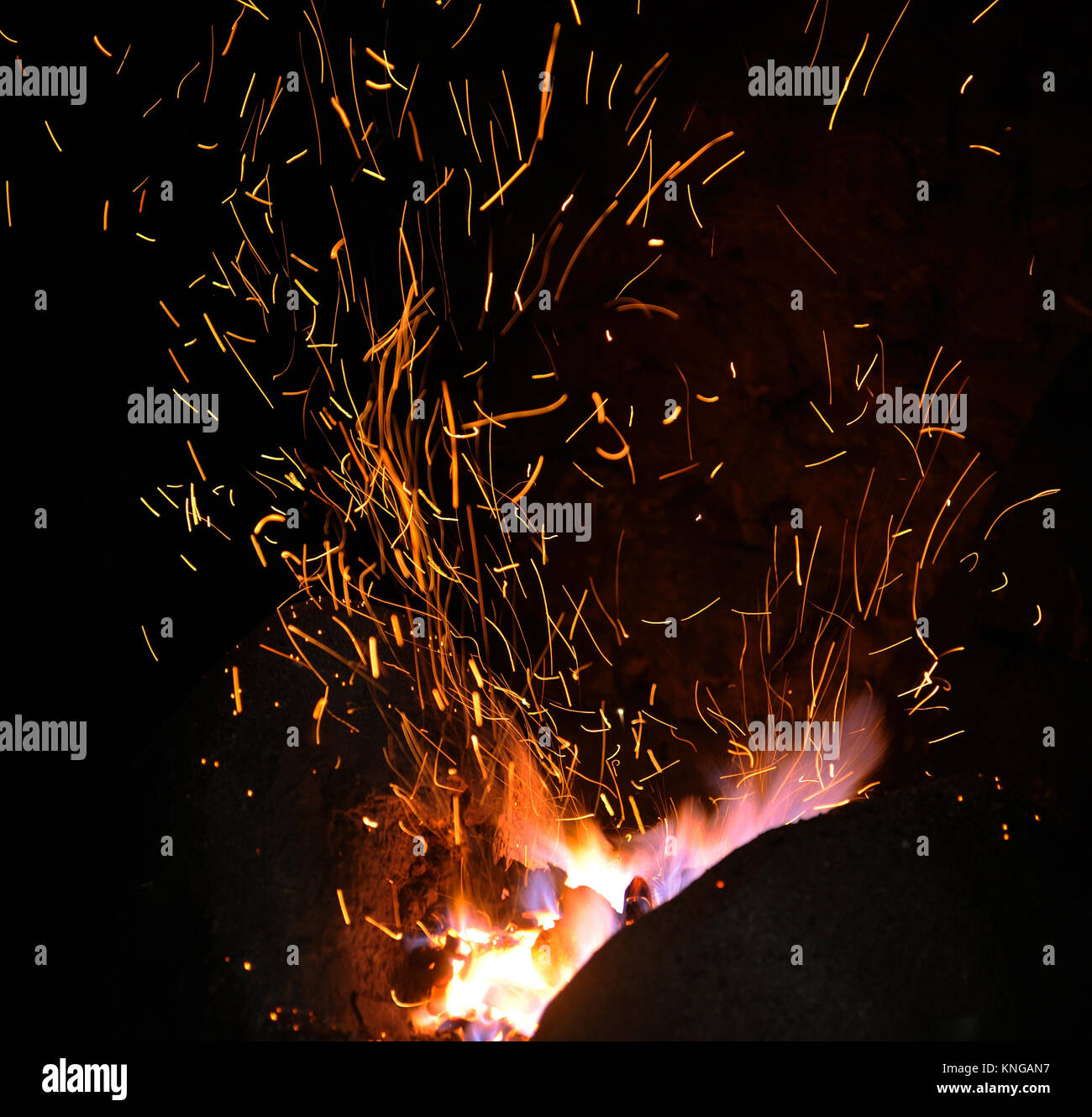 Smithy fire flame tips with sparks closeup on dark background Stock ...