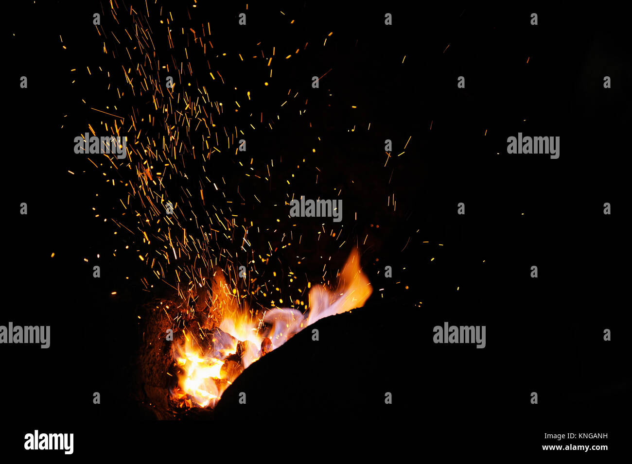 Smithy fire flame tips with sparks closeup on dark background Stock ...