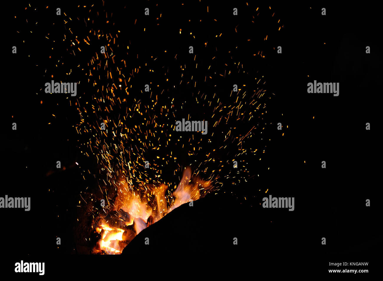 Smithy fire flame tips with sparks closeup on dark background Stock ...
