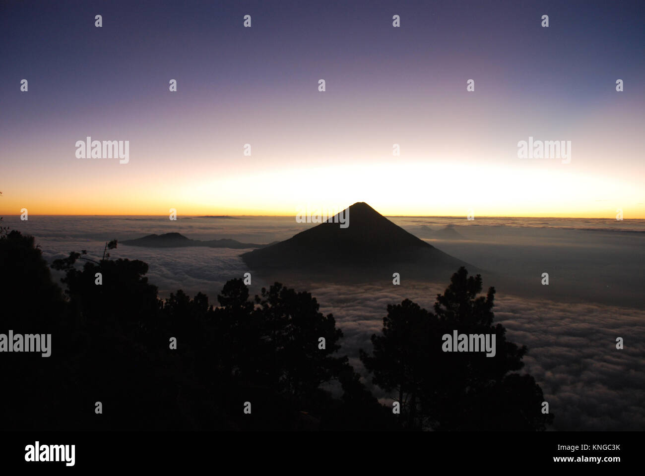 Sunrise behind volcano on hi-res stock photography and images - Alamy