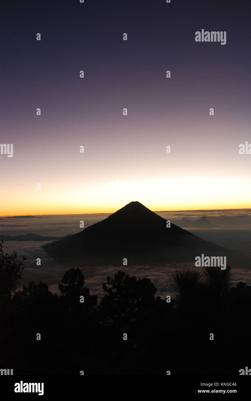 the sun rises behind the volcano Agua in Guatemala Stock Photo - Alamy
