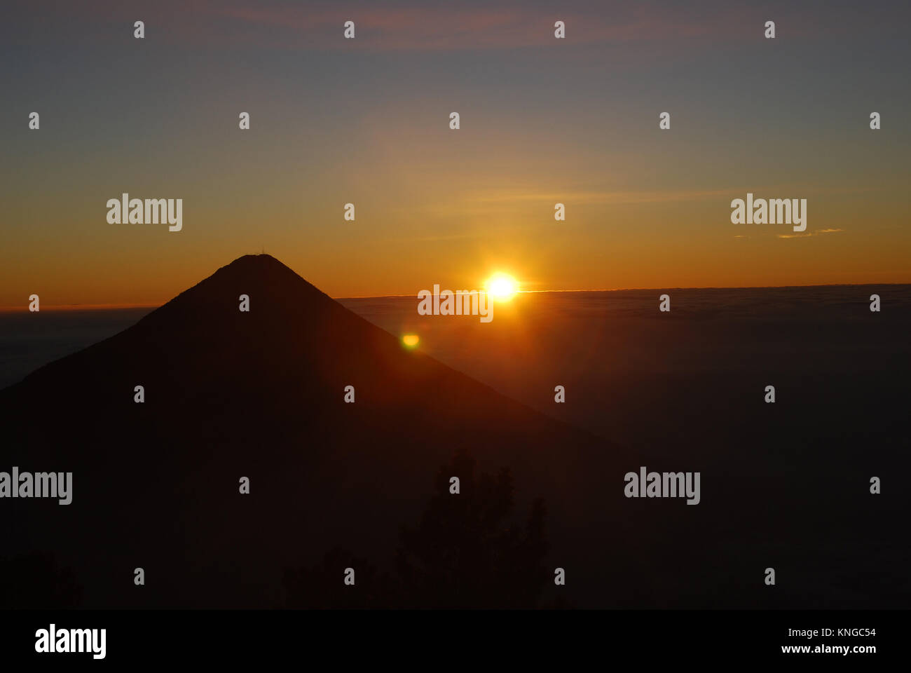 Sunrise behind volcano on hi-res stock photography and images - Alamy