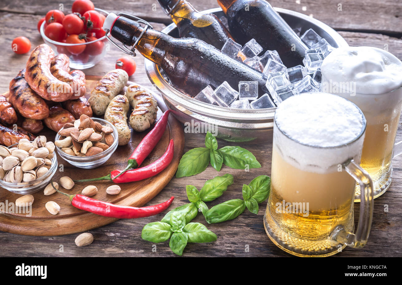 Appetizers and mugs of beer Stock Photo - Alamy