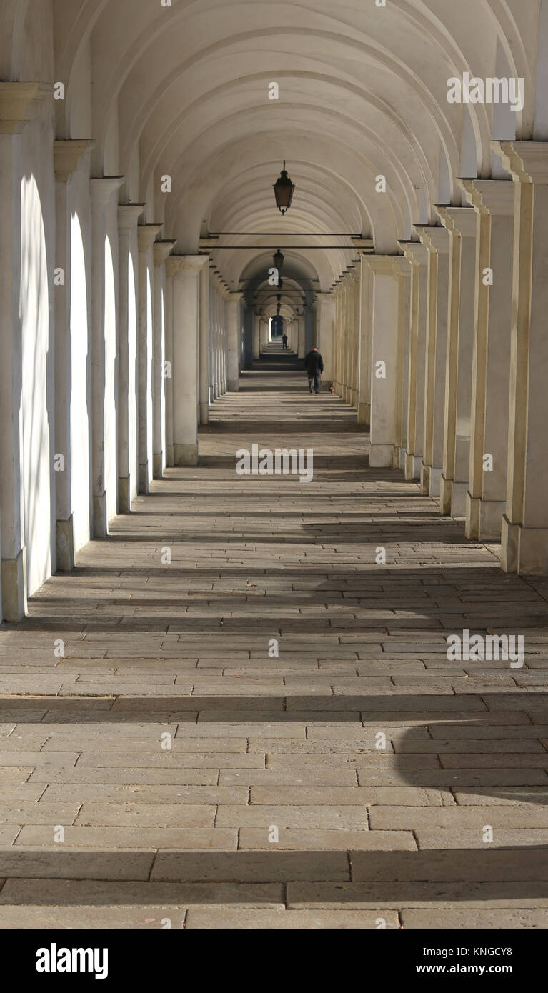 very long corridor with arches in slope Stock Photo - Alamy