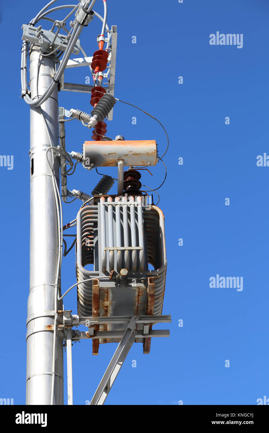 steel pole with electric transformer and high voltage electrical cables ...