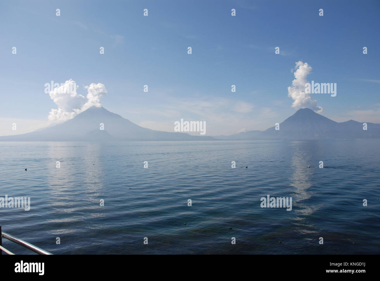Lake Atitlan in Guatemala which is surrounded by high cliffs and ...