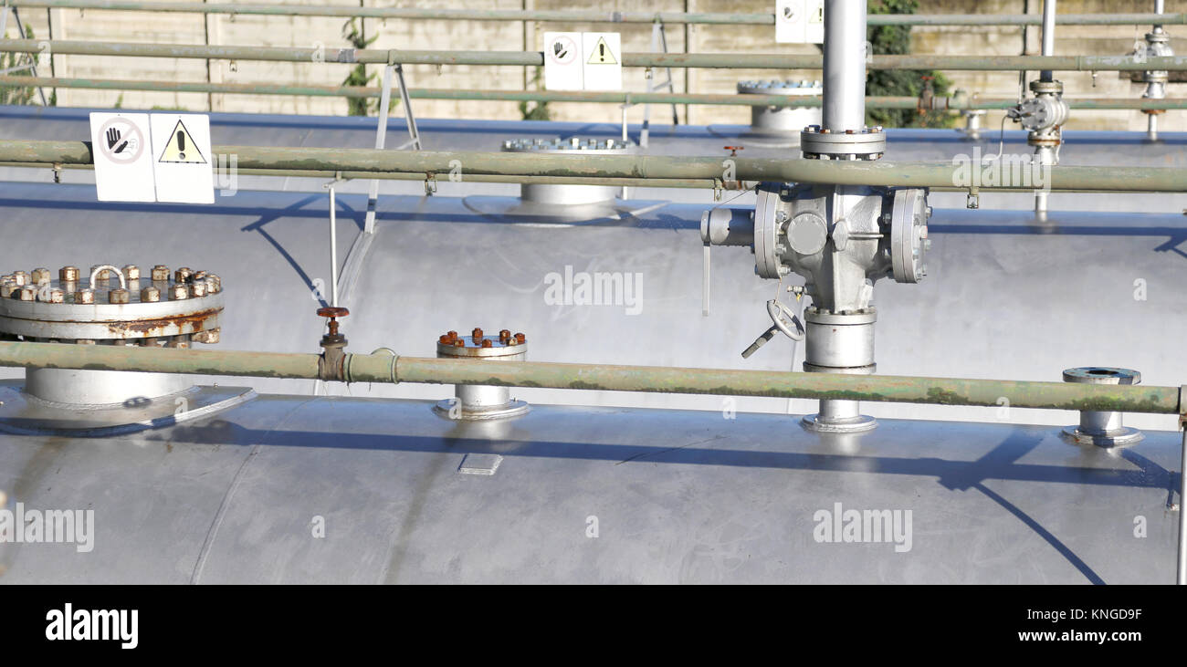large valves over metal cylinders for gas storage in the industrial ...