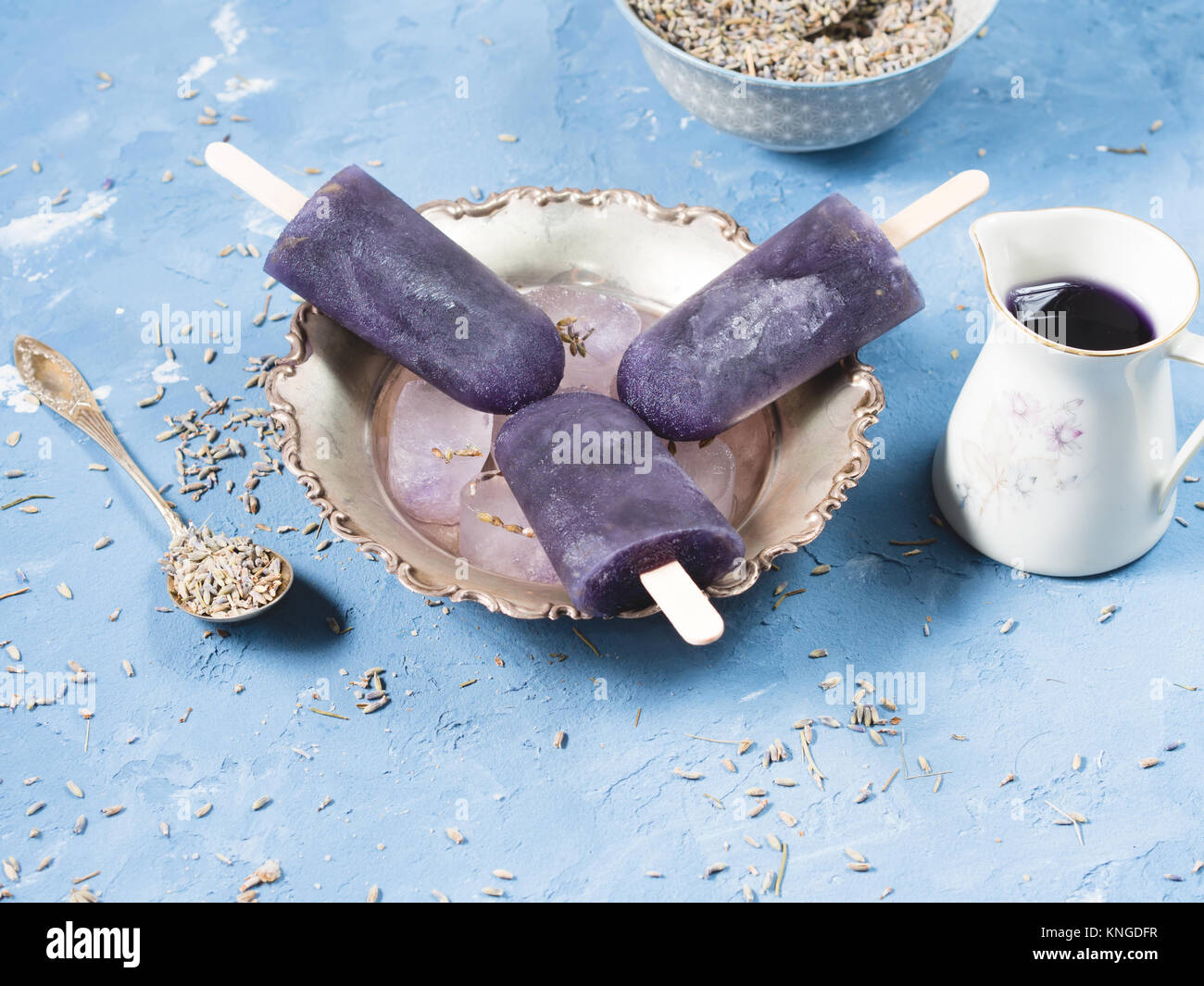 Lavender popsicles made of frozen orange and lemon juice with syrup in ...