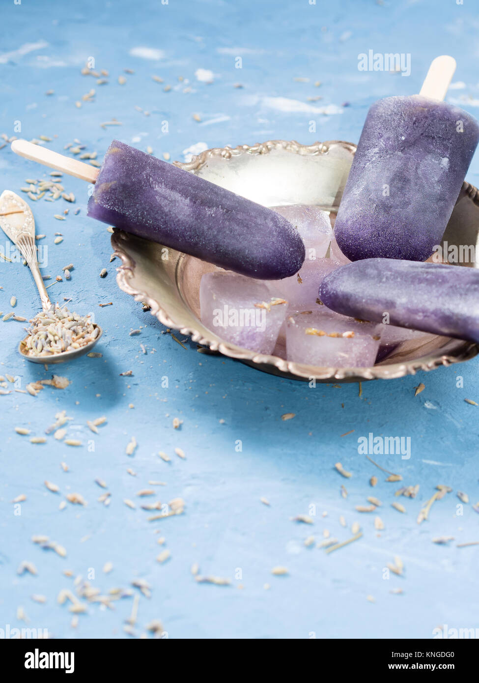 Lavender popsicles made of frozen orange and lemon juice with syrup in ...