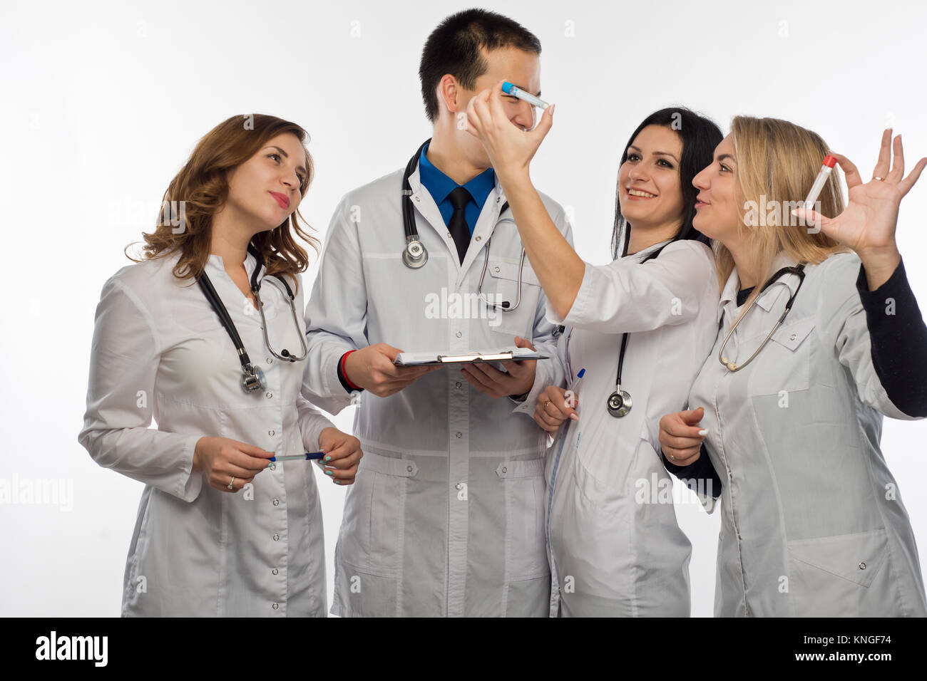 The Man A Doctor And Three Female Doctors Have Fun Discussing The Test Results White Background